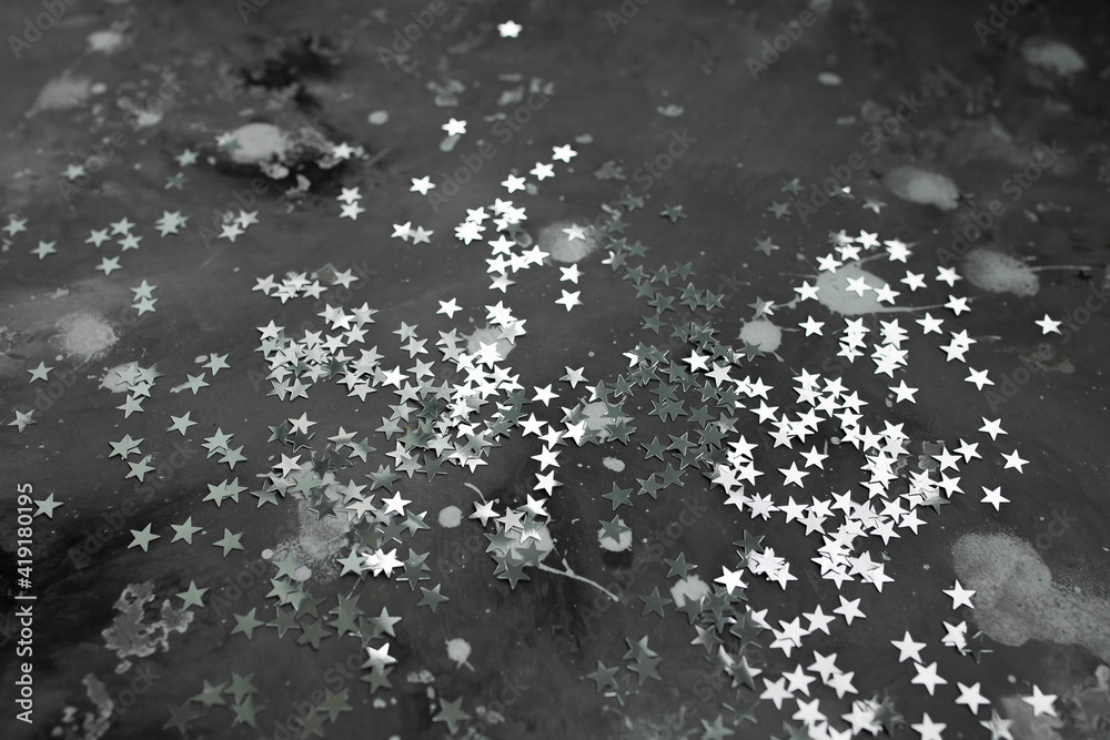 texture of gray concrete with spots of white paint and silver confetti ...