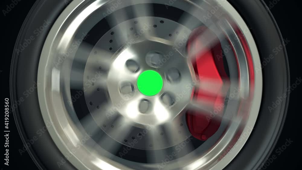 Fast spinning car wheel with green screen instead of brand badge with ...
