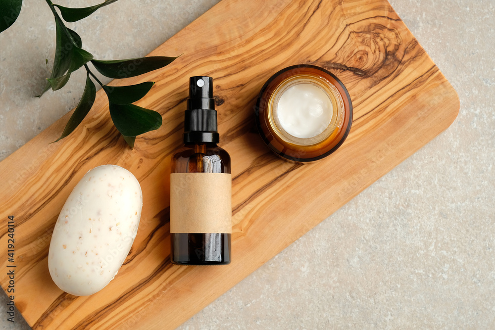 Natural organic SPA cosmetic products set with green leaves on wooden ...
