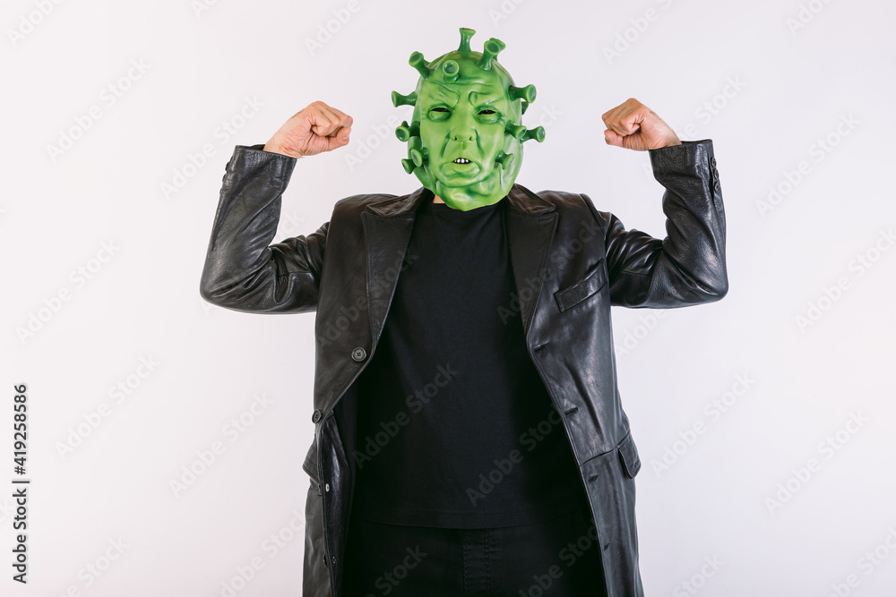 Person disguised as coronavirus with latex mask - covid-19 virus ...