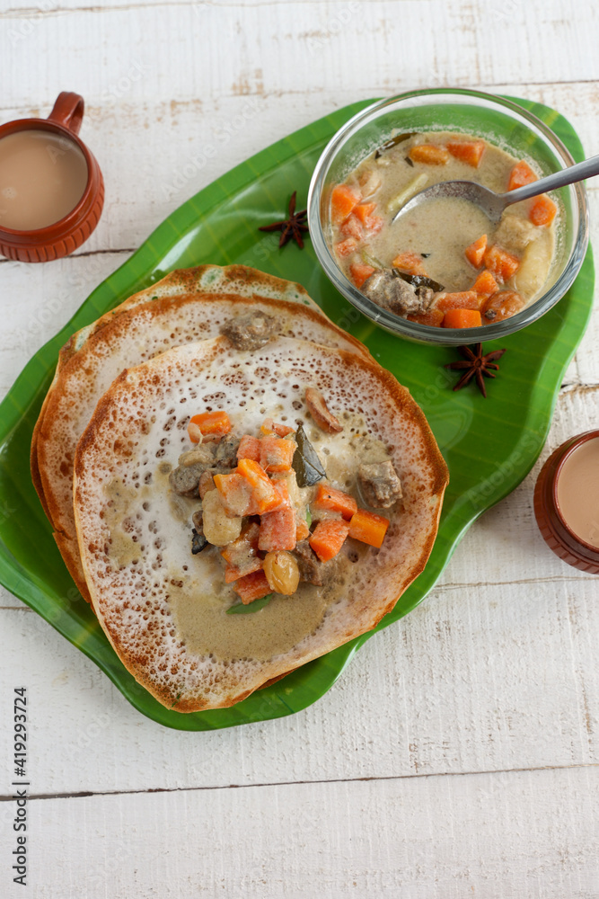 Appam, Hoppers and mutton stew Kerala breakfast food and Indian milk ...