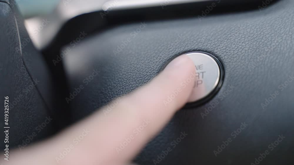 Engine start stop button from a modern car interior. Start car engine ...