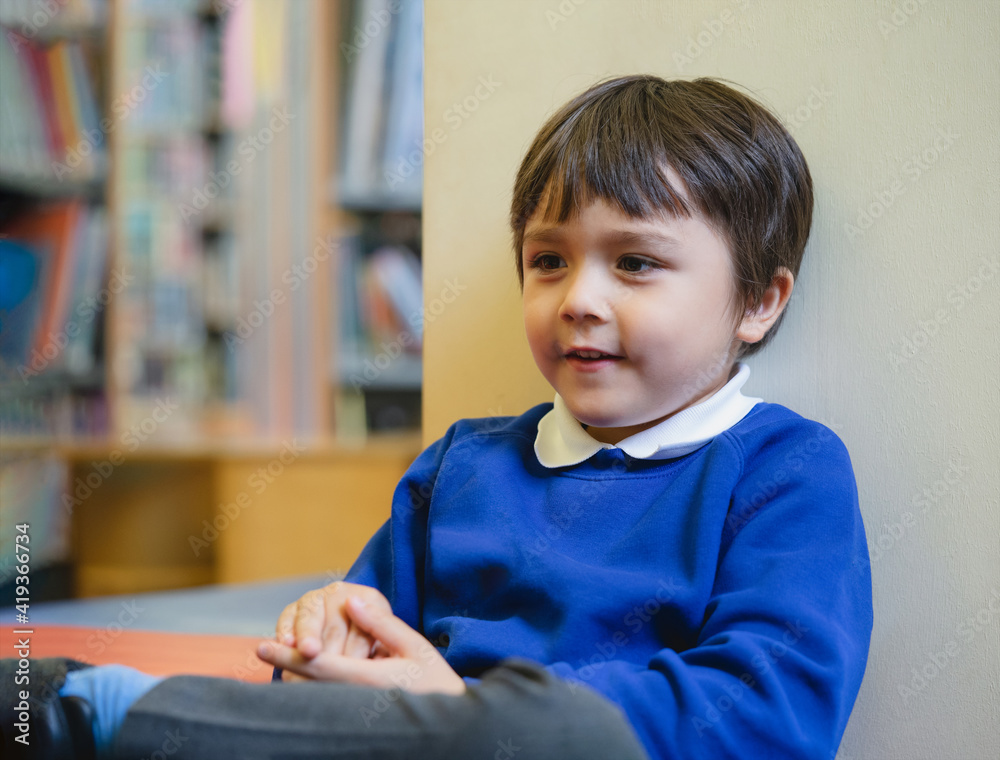 Cropped shot of Preschool kid sittng on sofa enjoy happy time in ...