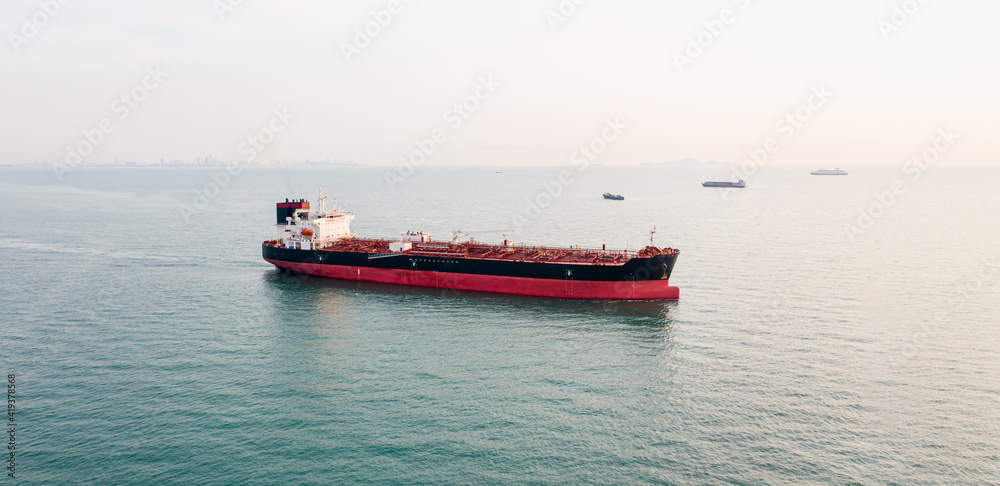 Aerial angle side view of oil tanker container ship at sea. Crude oil ...