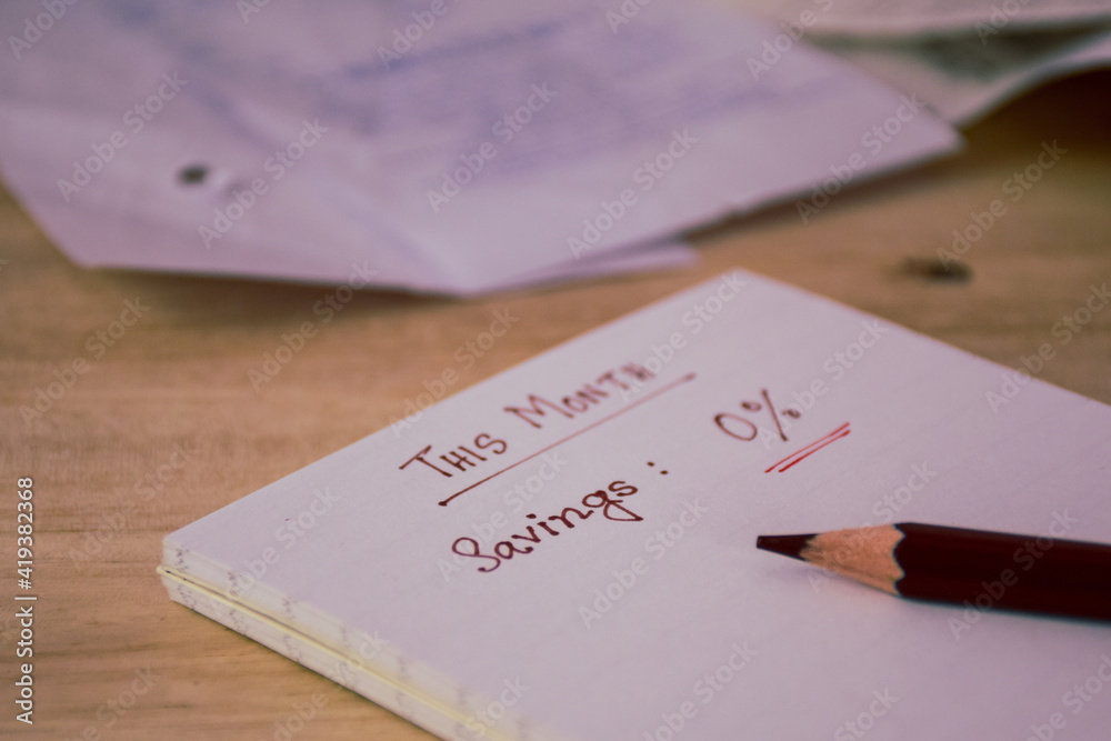 Cost reduction concept. Handwritten note saying zero percent monthly ...