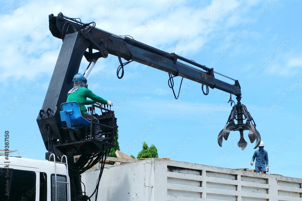 Poster Workers are controlling machine loader manipulator with ...