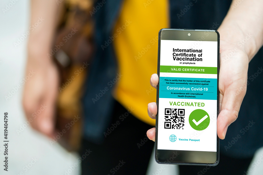 Smartphone displaying a valid digital vaccination certificate passport ...