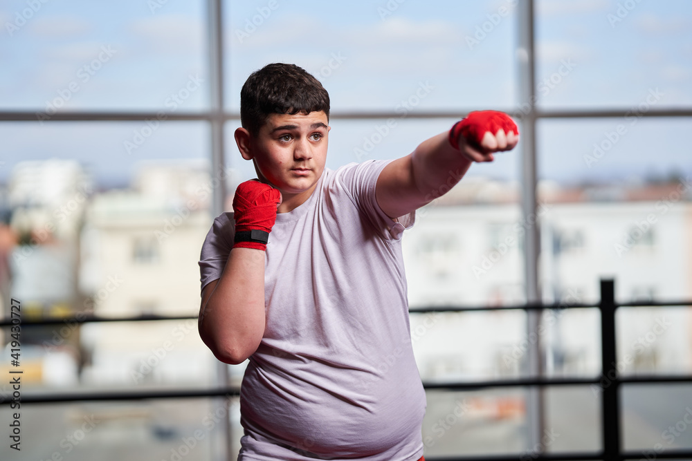Fat kickboxer doing shadow boxing Stock Photo | Adobe Stock