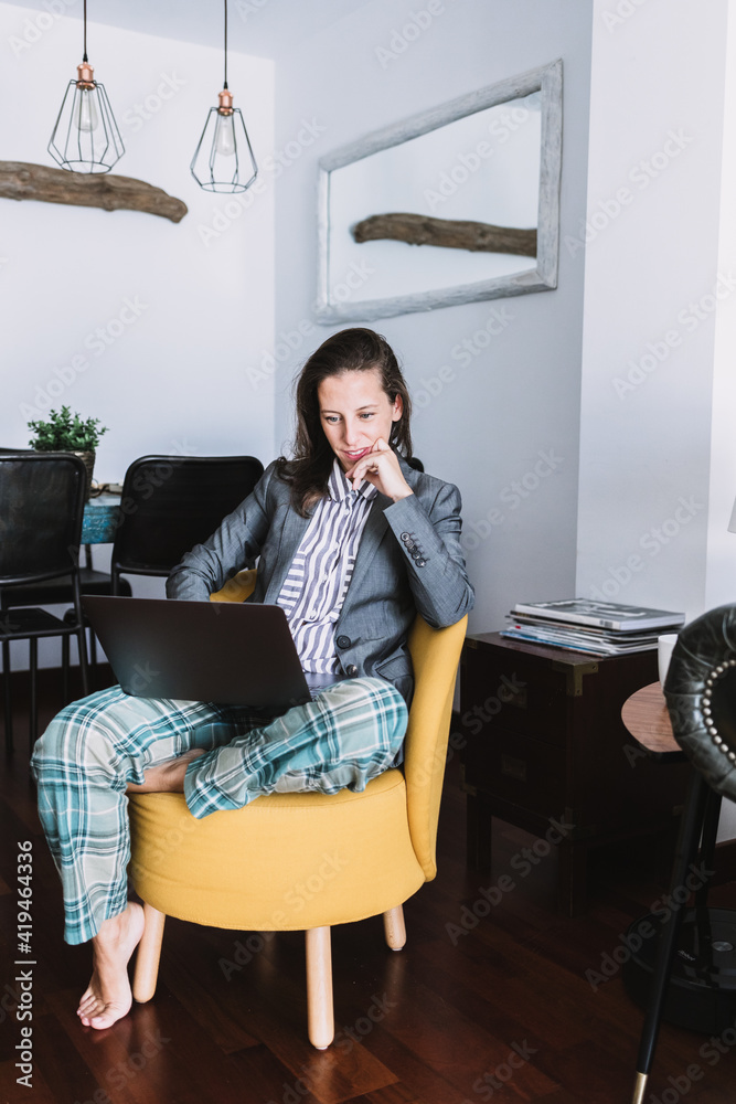 Full body of young female remote employee wearing formal blazer and ...