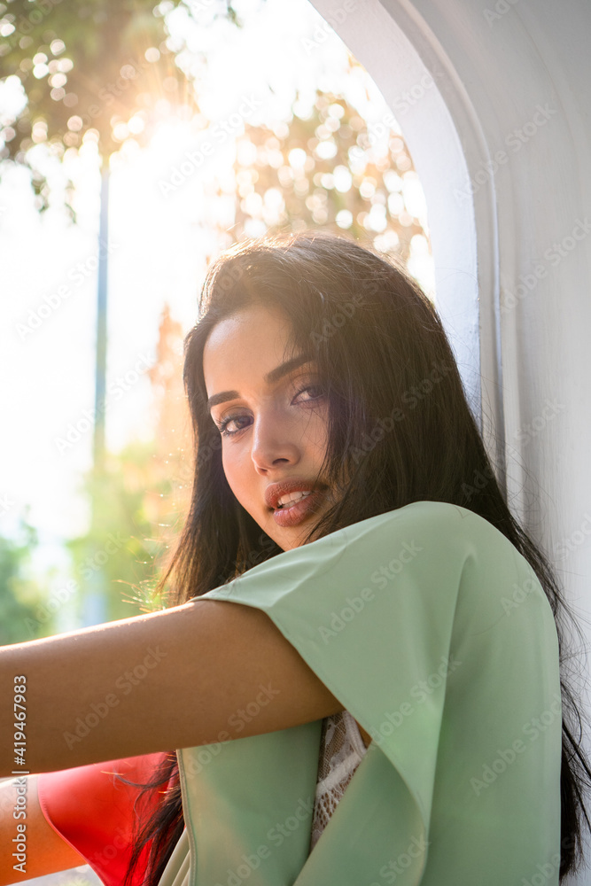 Side view of cheerful charming young ethnic Indian female in stylish ...
