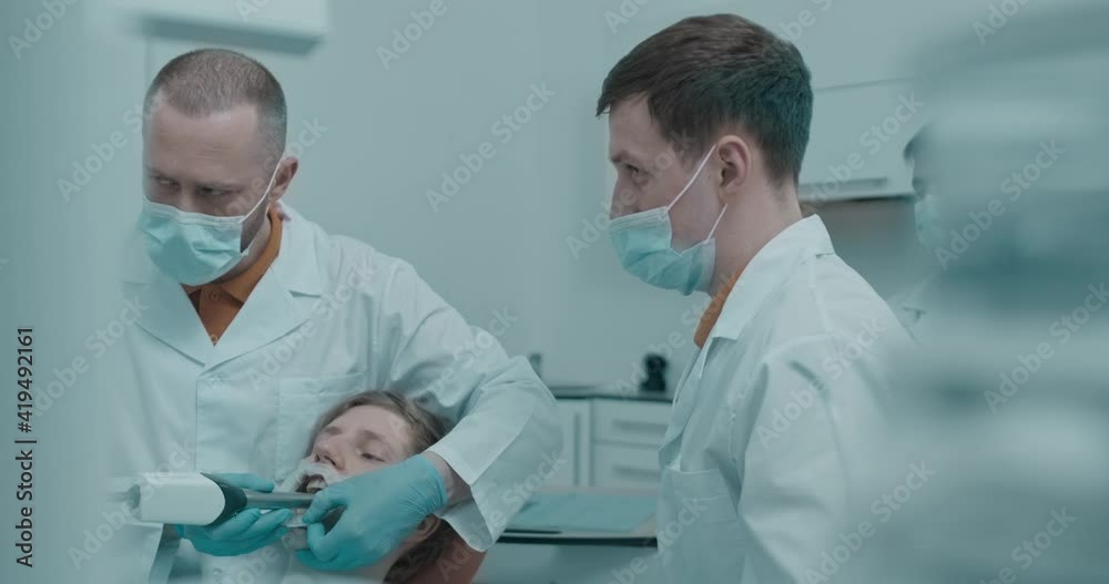 Dentist is using intraoral scanner while examined patient teeth in ...