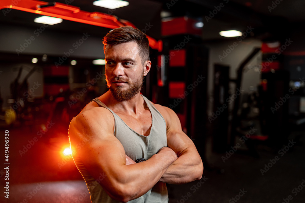 Strong man with muscular body type training in sports hall. Stock Photo ...