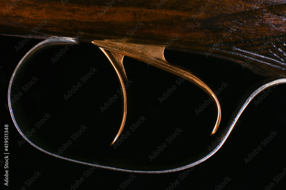 Details of an elegant double-barreled hunting classic shotgun on a black background close-up ...