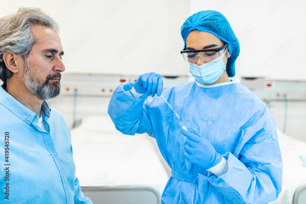 Mature man getting PCR test for coronavirus during appointment at ...
