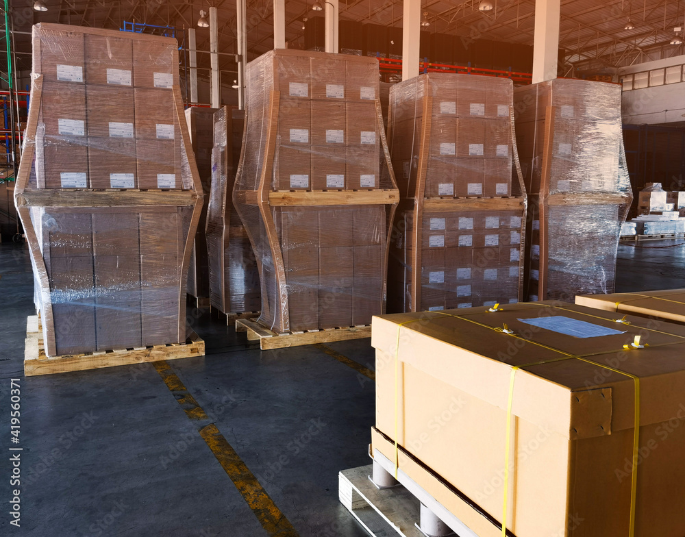 Shipment cartons box on pallets and wooden case on hand lift in ...