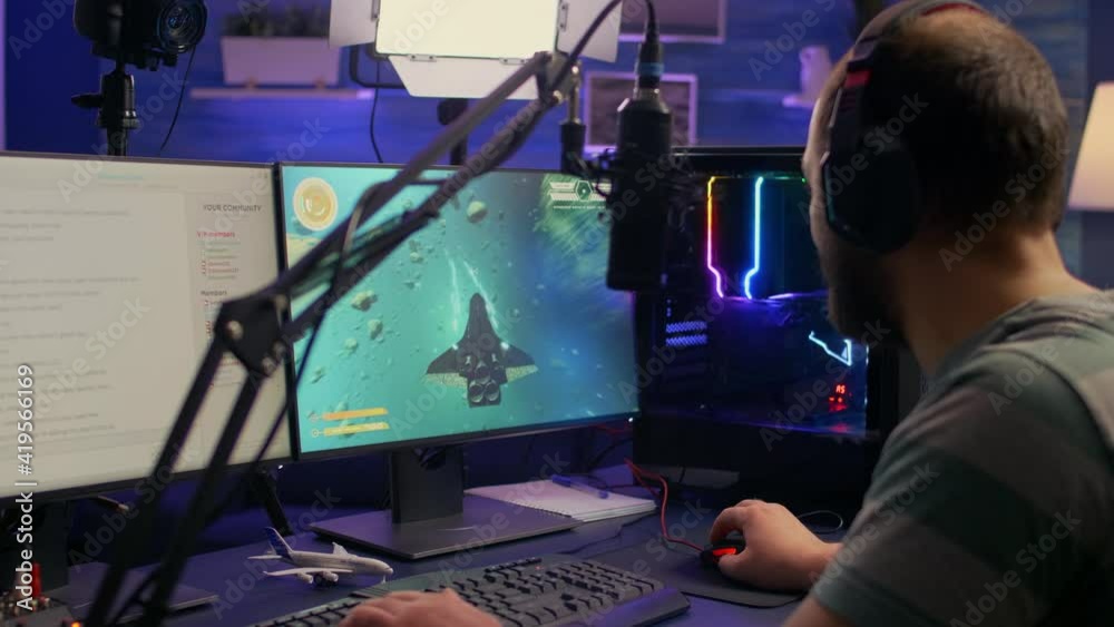 Pro streamer man playing space shooter video games during online ...