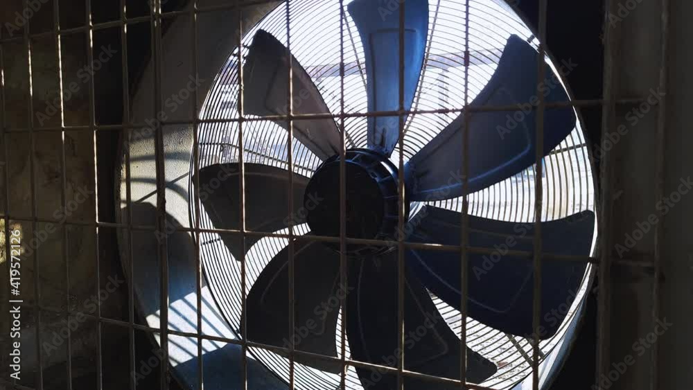 Big industrial fan in a white brick wall of a factory. Ventilation of ...