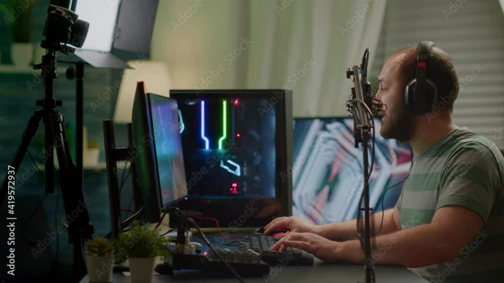 Professional digital player with headphones streaming video game with ...