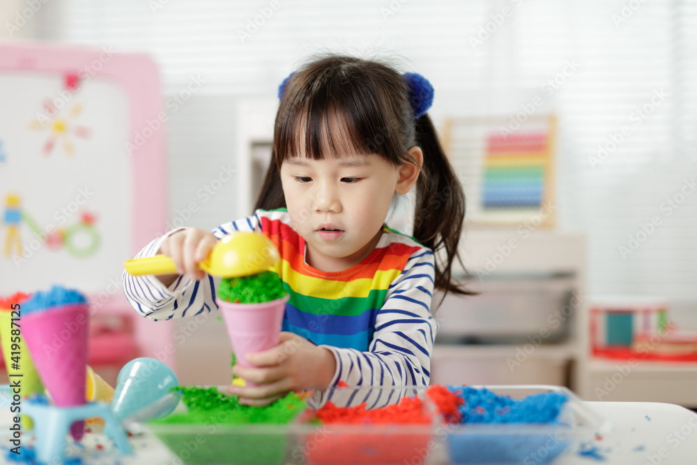 young girl playing color sorting and fine motor skill for homeschooling ...