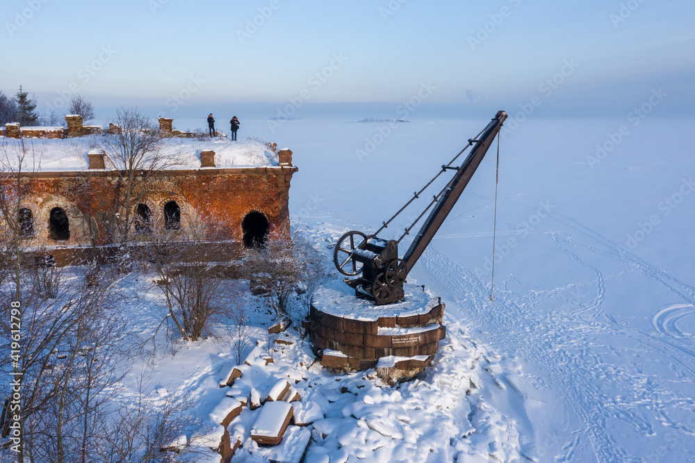 An old metal crane at the pier of the fourth northern fort of Zverev ...