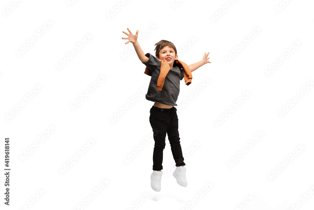 Jumping, flying. Happy, smiley little caucasian boy isolated on white ...