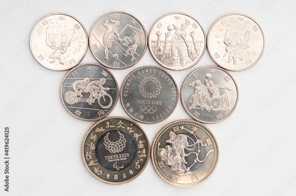 Tokyo, Japan - January 4, 2021: Commemorative coins of 100 yen and 500 ...
