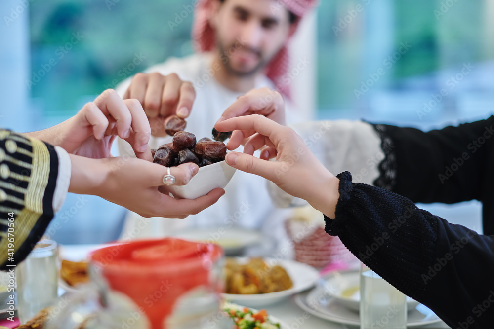 Muslim family having iftar together during Ramadan. Stock Photo | Adobe ...