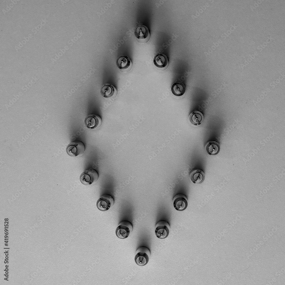 5.56mm bullets arranged in the shape of a diamond in black and white ...