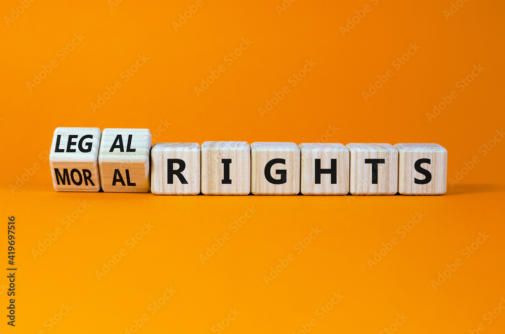 Moral or legal rights symbol. Turned wooden cubes and changed words ...