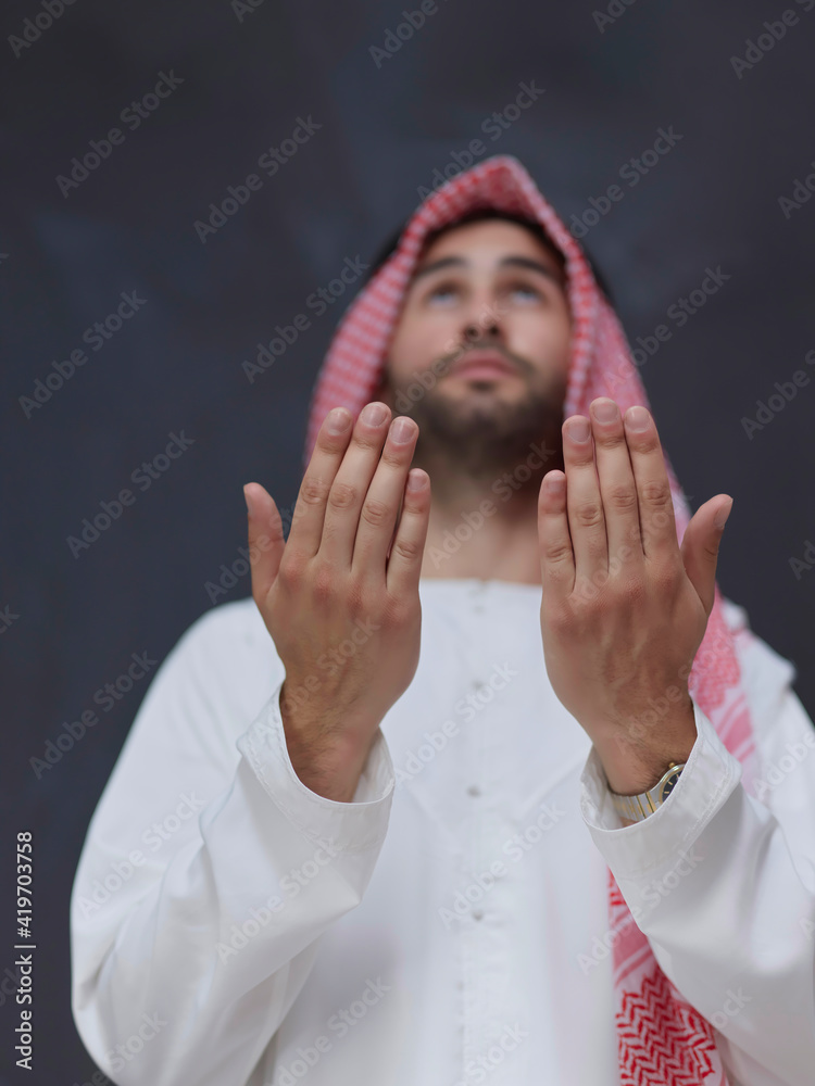 Arab man in traditional clothes praying to God or making dua Stock ...
