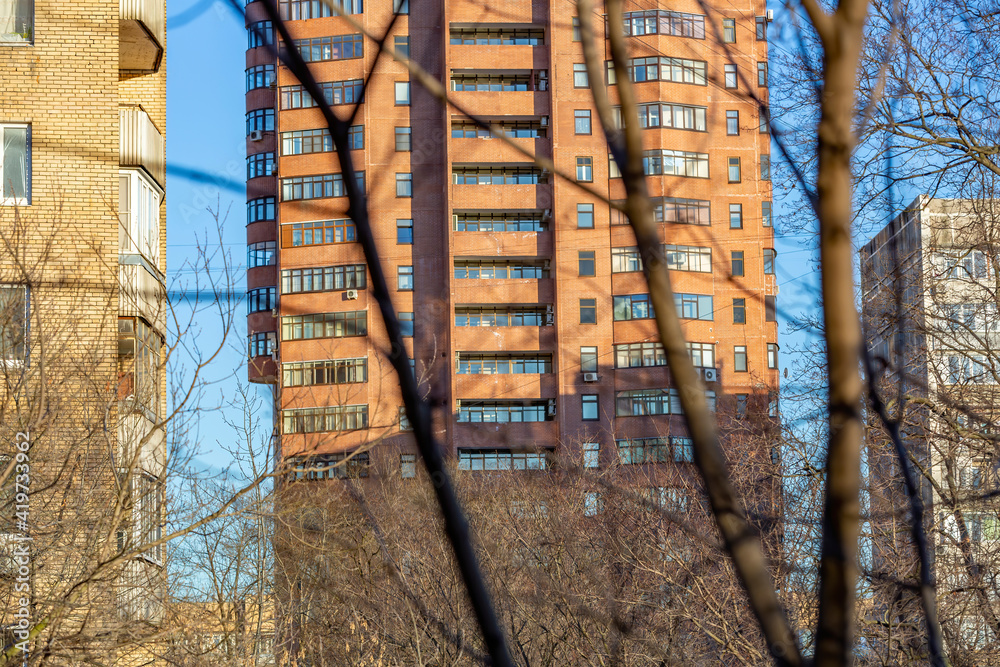 Old-fashioned brick multi-storey building. Typical Eastern European ...