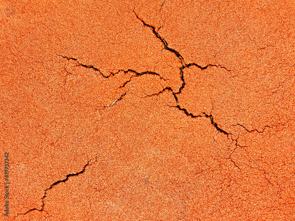 Rubber floor texture background. EPDM playground surface. Red cracked ...