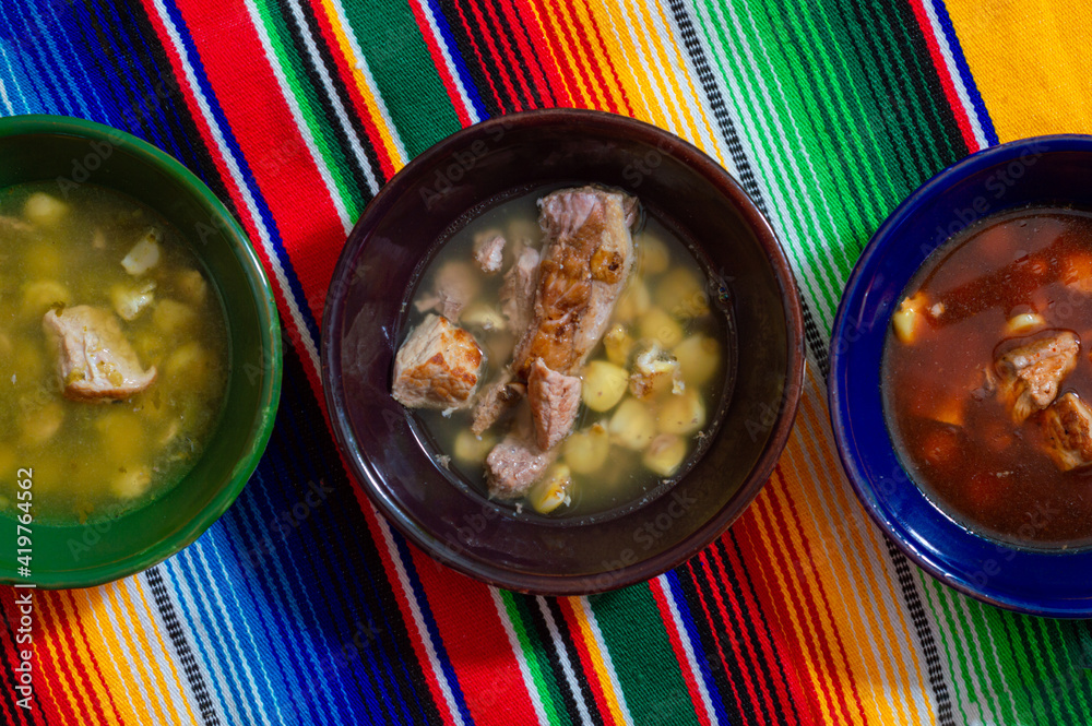 White, green and red pozole. Mexican pork and hominy corn stew Stock ...