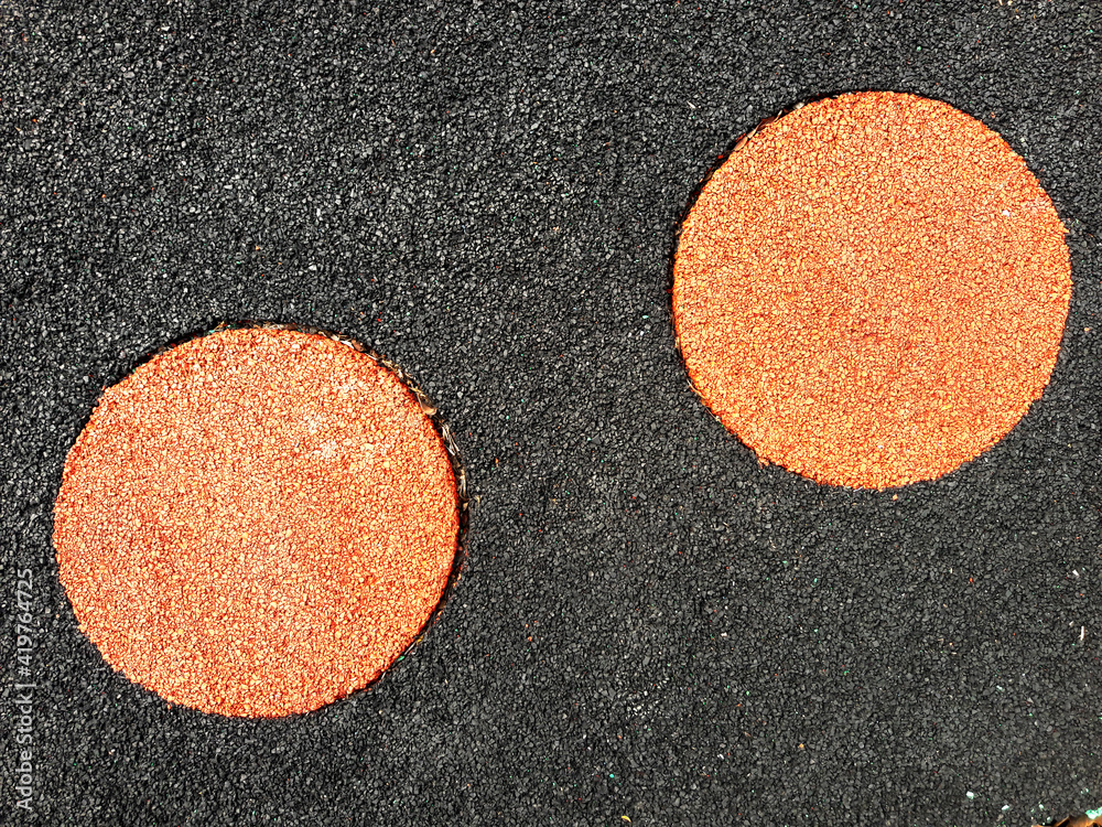 Rubber floor texture background. EPDM playground surface. Black and red ...