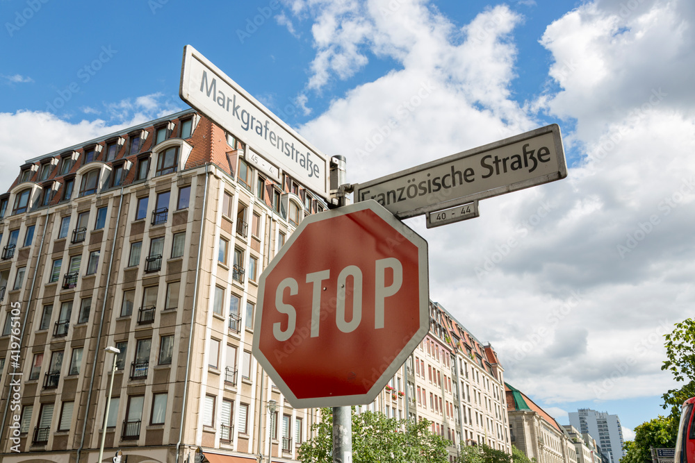 STOP road sign and direction signs of street names in Berlin Stock ...
