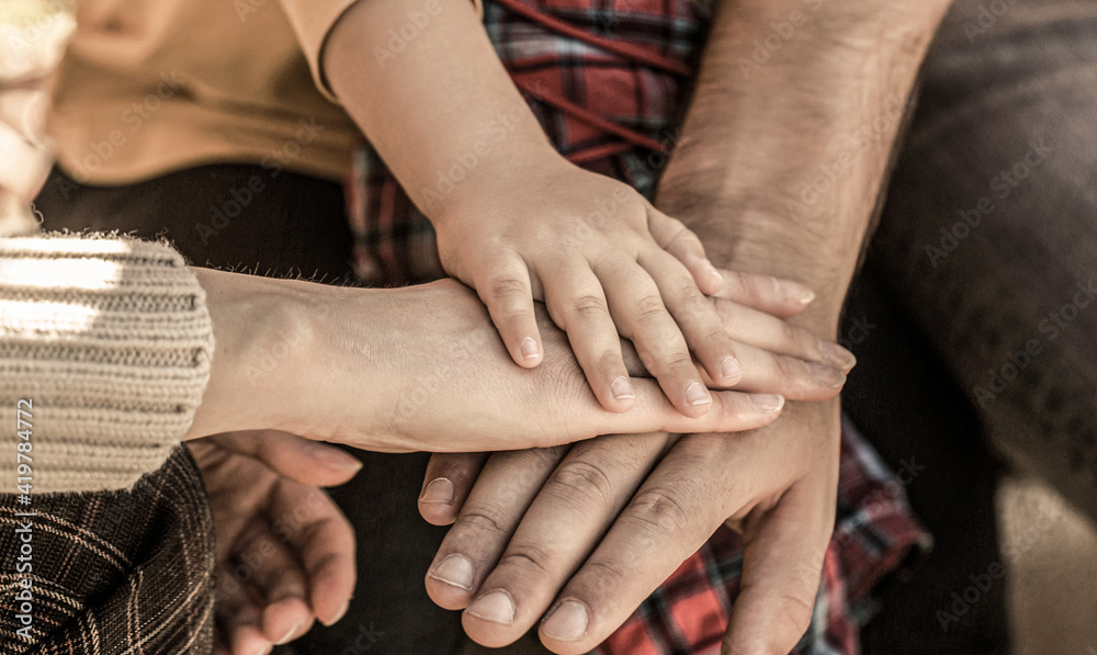 Child hand closeup into parents. Hands of father, mother, keep hand ...