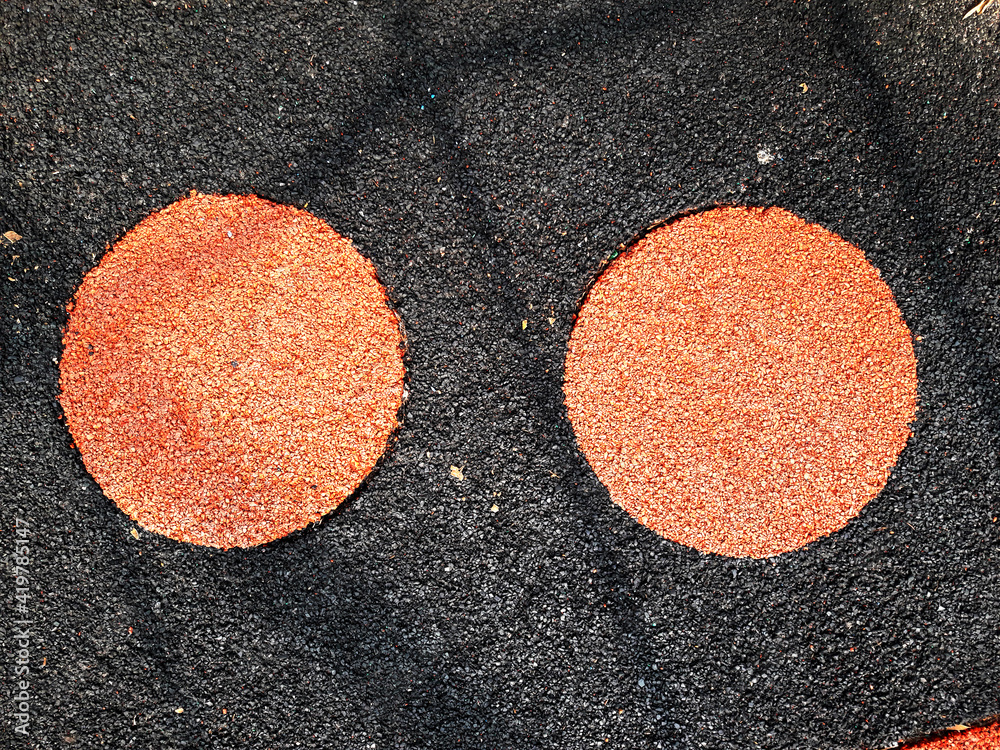 Rubber floor texture background. EPDM playground surface. Black and red ...