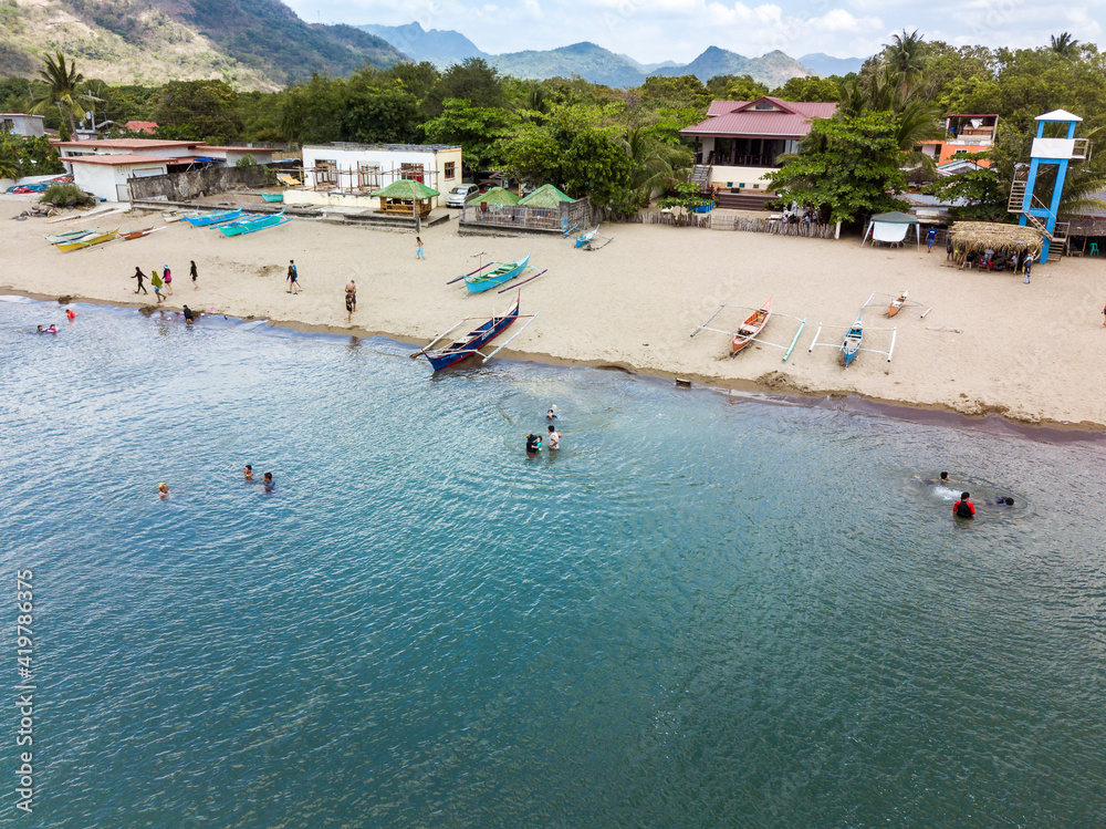 A weekend vacationers crowd a public beach in Calayo, Nasugbu, Batangas ...