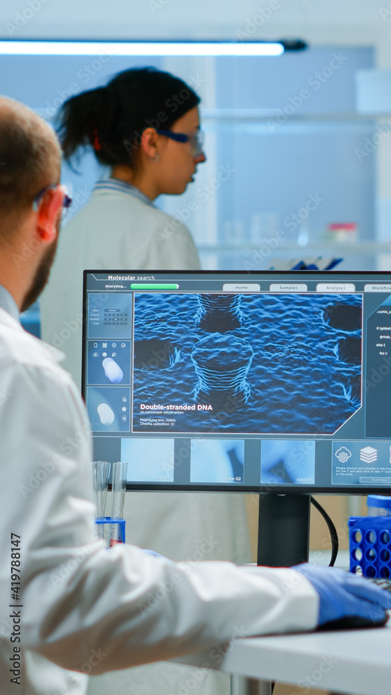 Man scientist working to develop a new vaccine in modern equipped ...