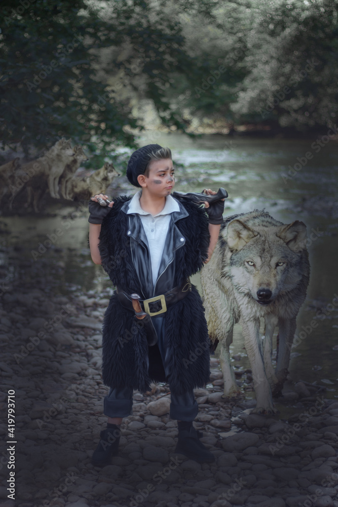 boy in the forest with wolves in a hunter costume Stock Photo | Adobe Stock