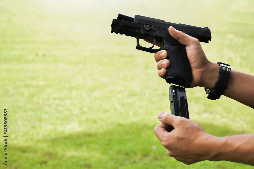 Automatic shotgun holding in hands ready to shoot, concept for security ...