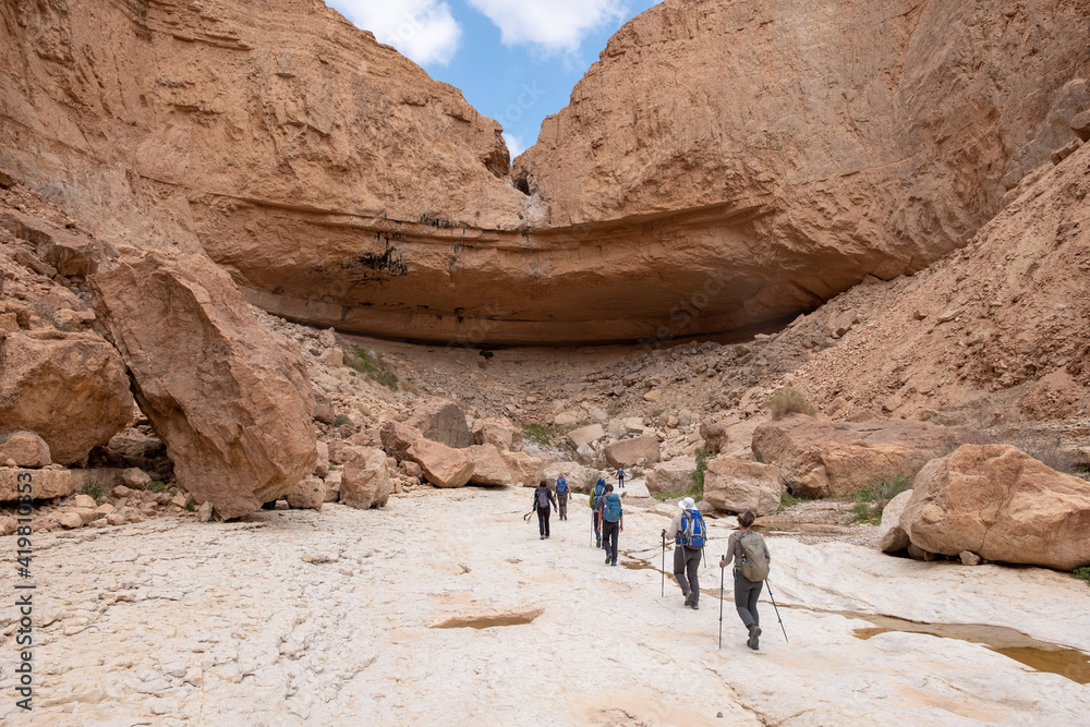 Landscape of a white stone bed of dry wadi Hever, the nature reserve in ...