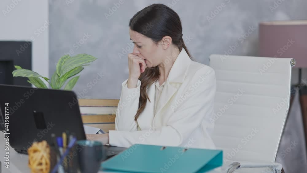 Crying overwhelmed young woman sitting in office. Portrait of stressed ...