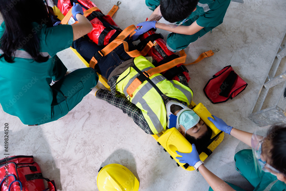 First aid for injuries in work accidents. Using first aid equipment ...
