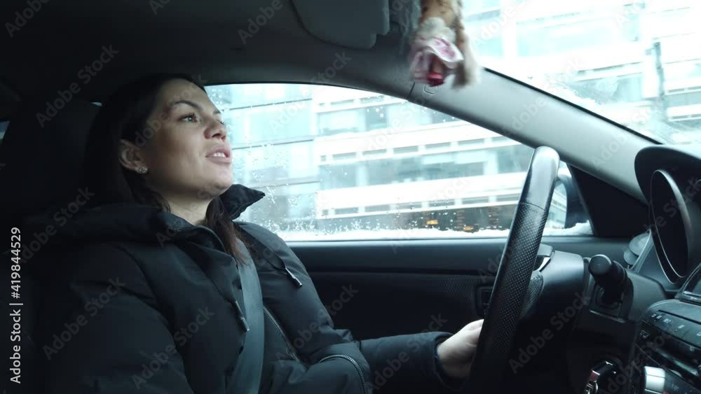 Portrait of female, side view. Woman driver on the road. Young woman is ...