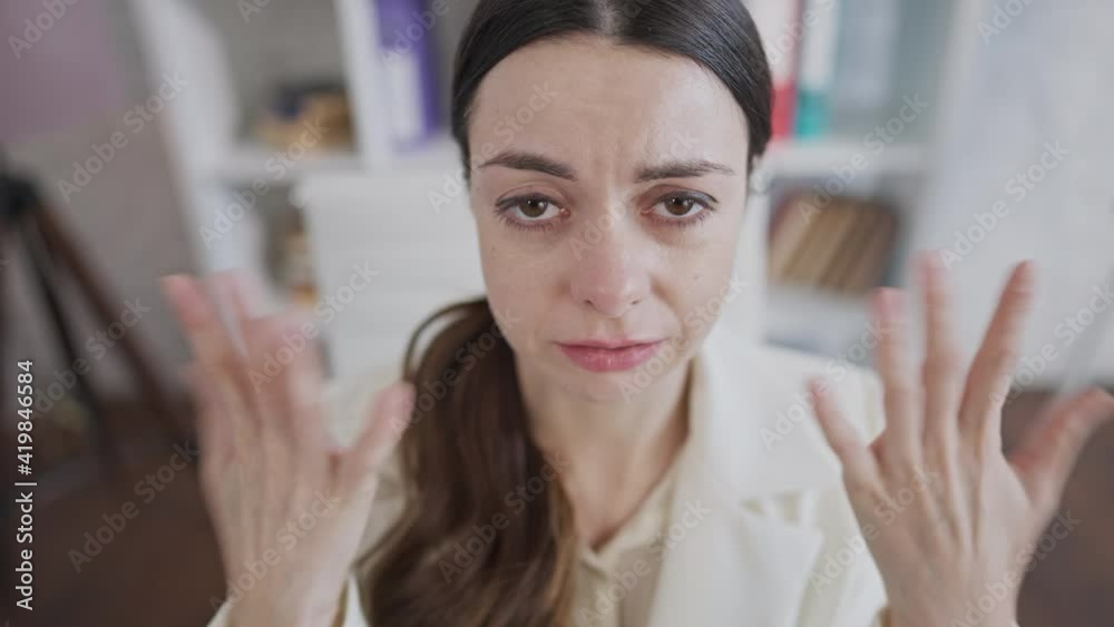 Face of desperate overwhelmed young woman crying in office at workplace ...