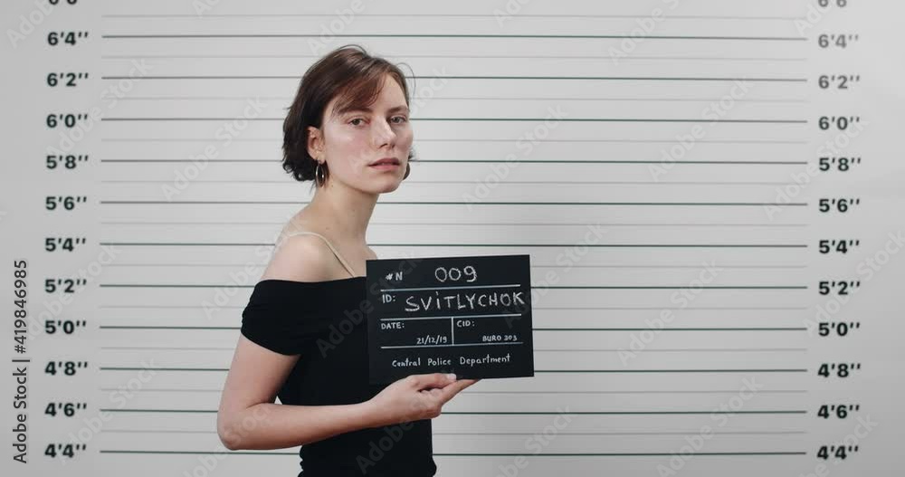 Portrait of arrested millennial woman turning head and looking to ...