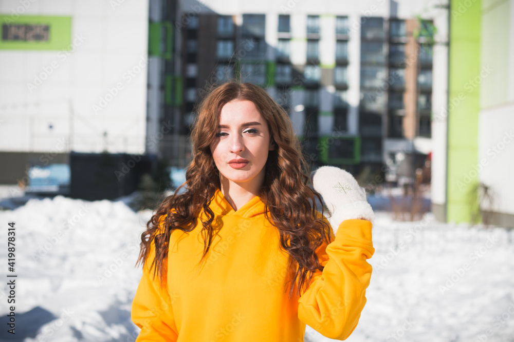 Beautiful and stylish Russian girl model in winter on the street of ...
