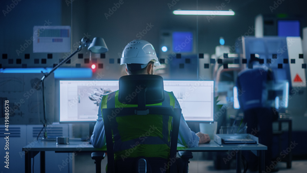 Industrial Engineer Solving Problems, Working on a Personal Computer ...