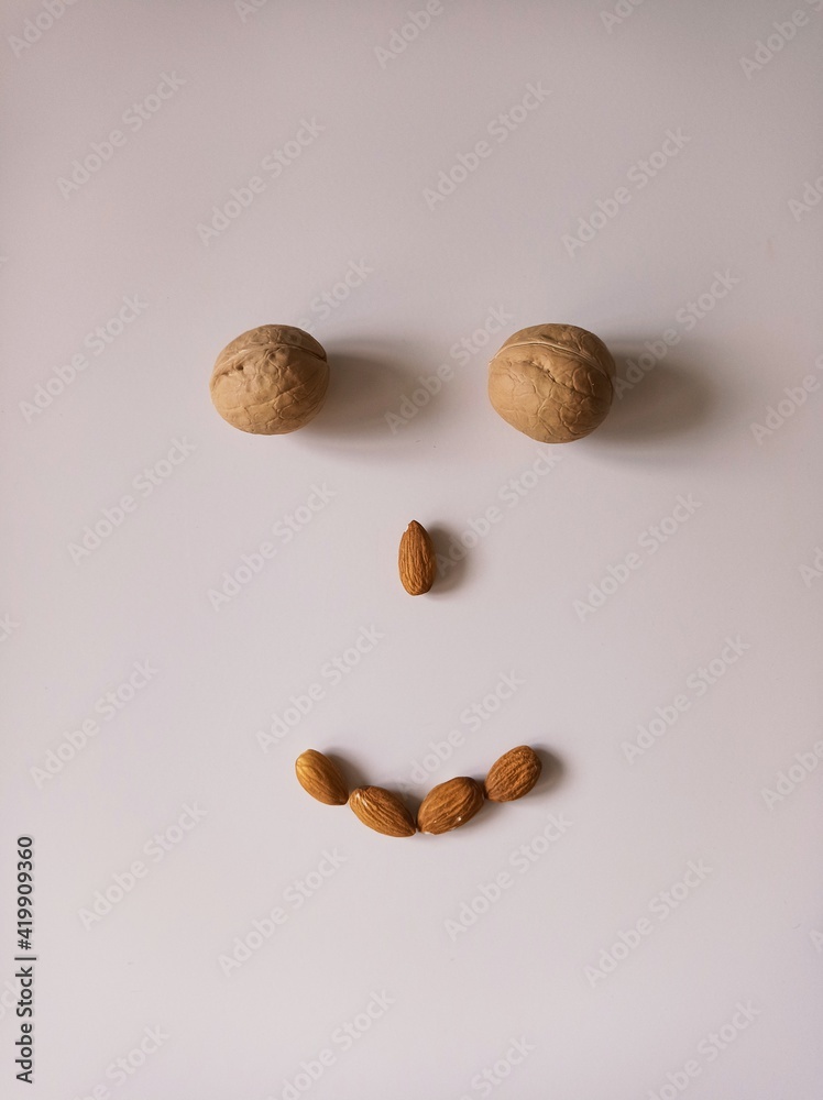 smiley face made of nuts, walnuts and almonds Stock Photo | Adobe Stock